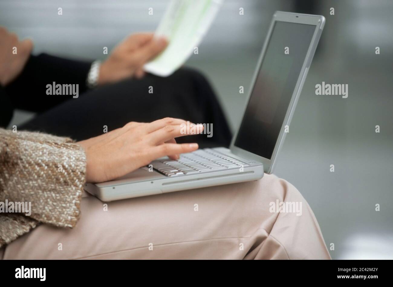 Woman is typing something into a laptop - Mobility - Technology Stock ...