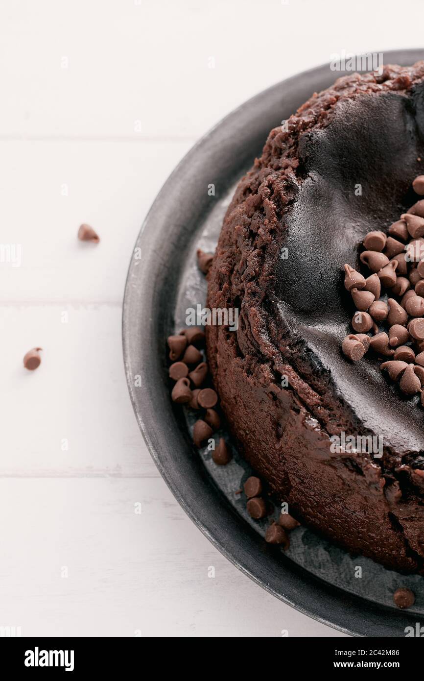 Overhead view of a chocolate basque burnt cheesecake with chocolate ...