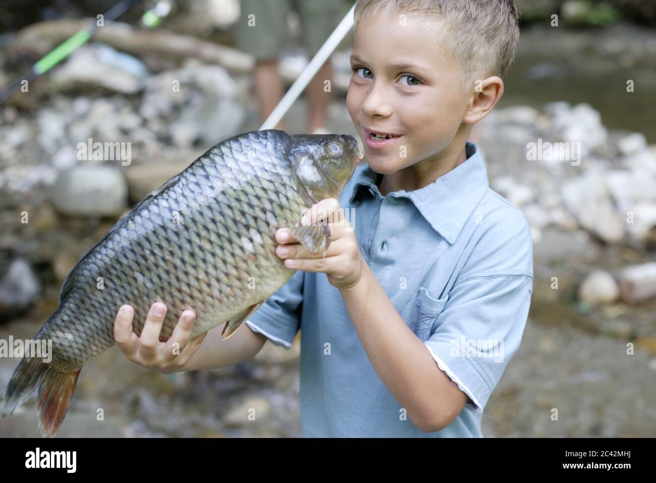 Holds a fish hi-res stock photography and images - Alamy