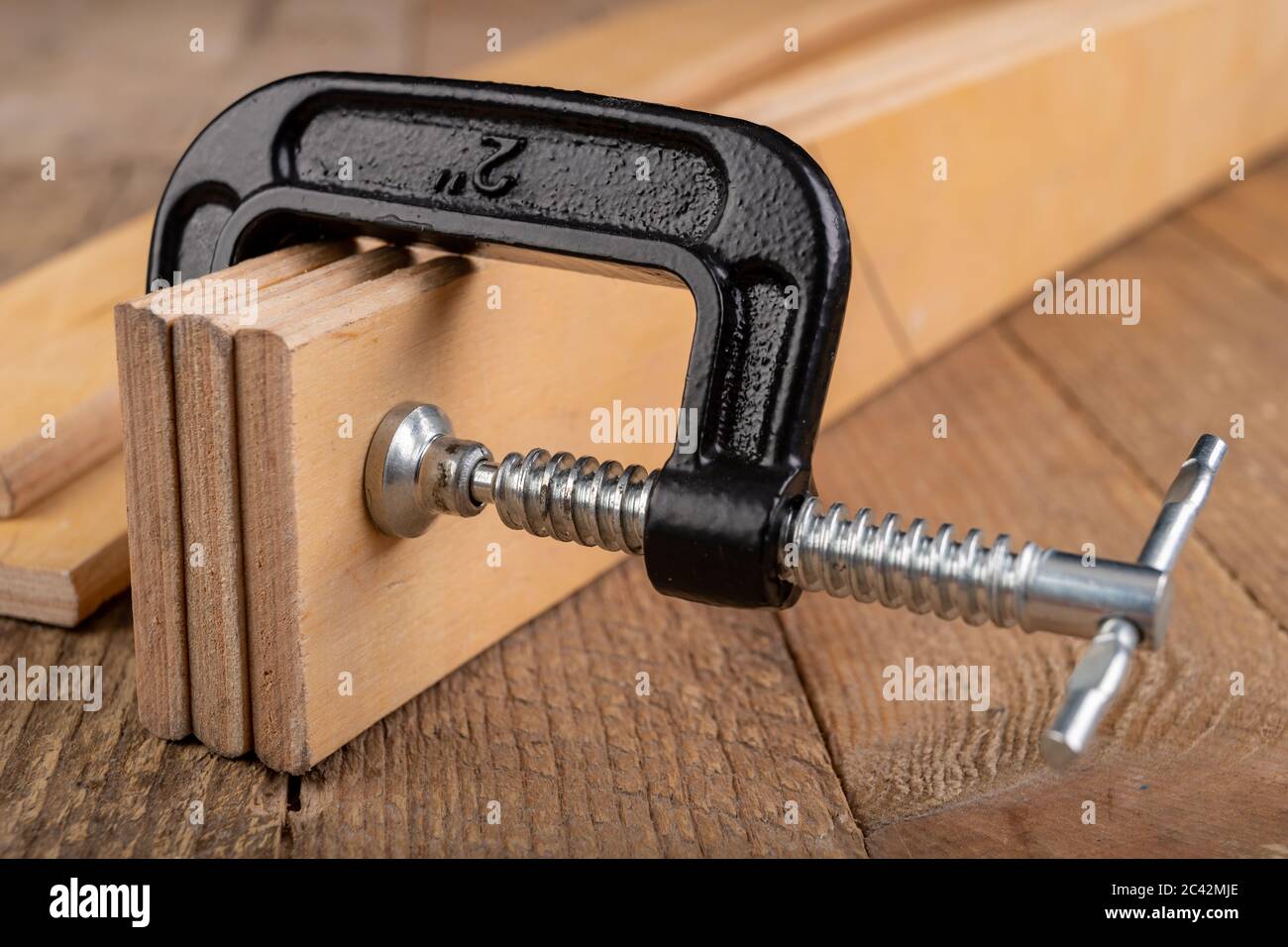 Carpentry clamp used for gluing wood. Carpentry accessories in a home ...