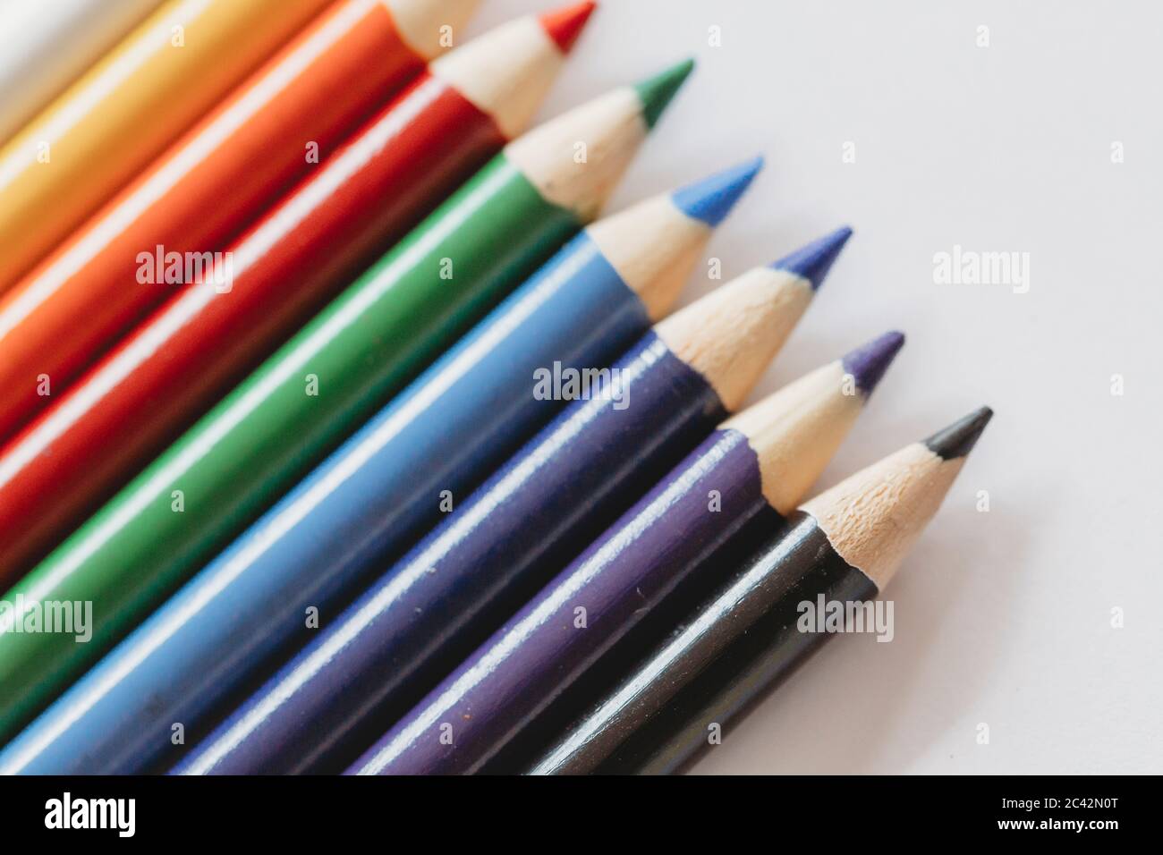 Multi-colored coloring pencils on white background Stock Photo - Alamy