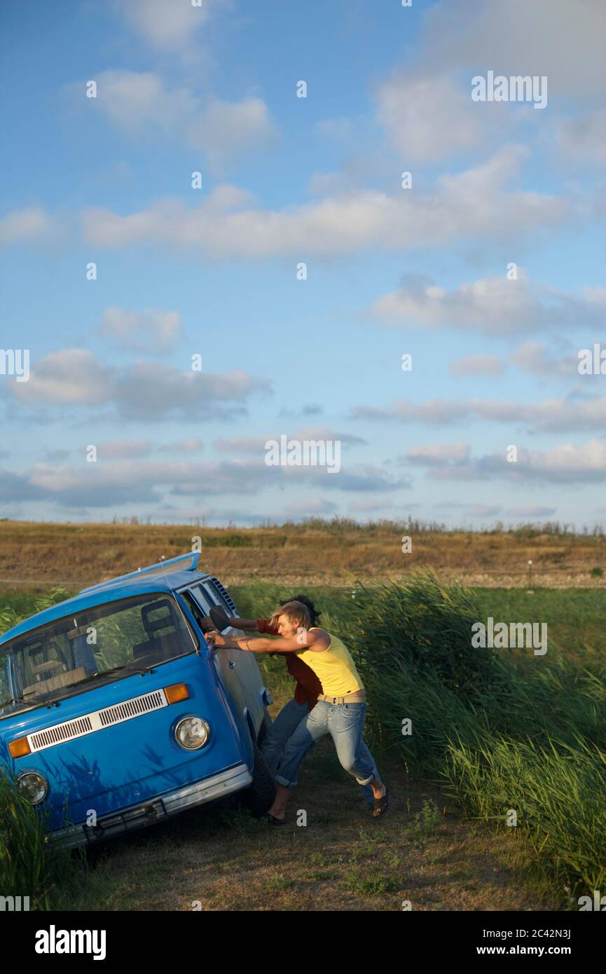 Two young men hold bus Stock Photo - Alamy