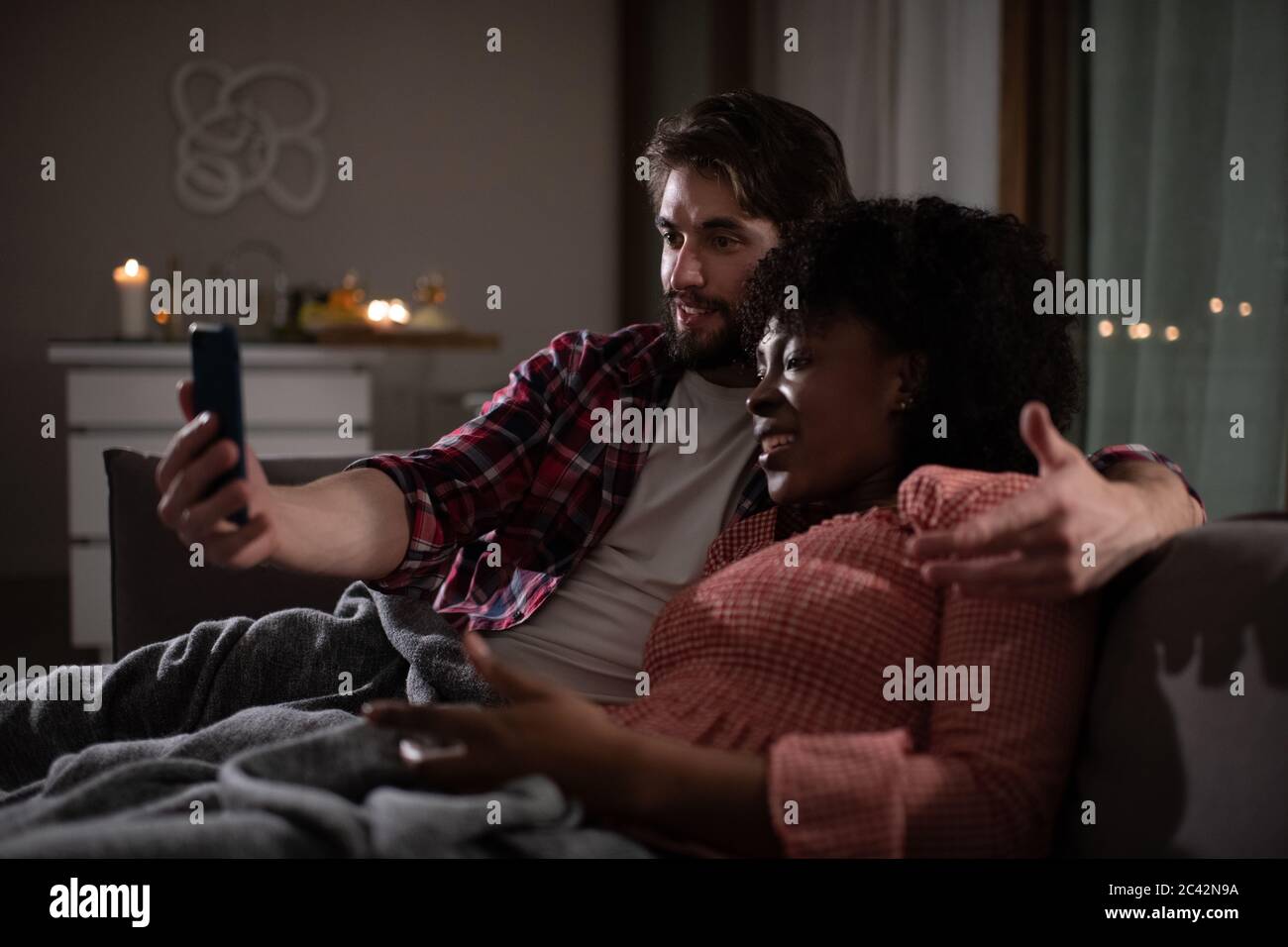 Couple chilling on sofa hi-res stock photography and images - Alamy