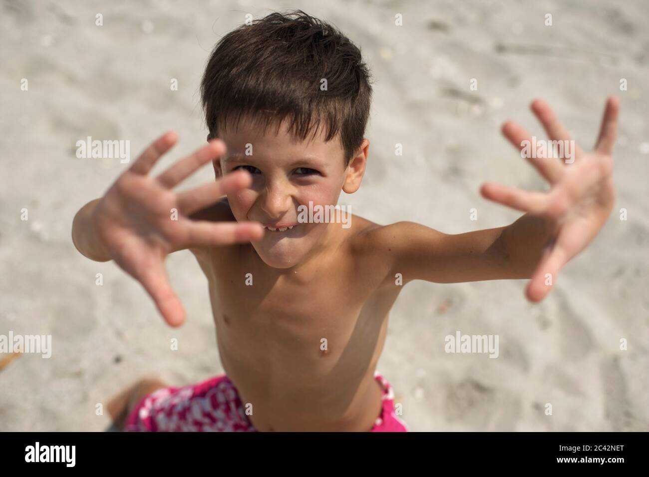 Boy shows hands at the camera Stock Photo - Alamy