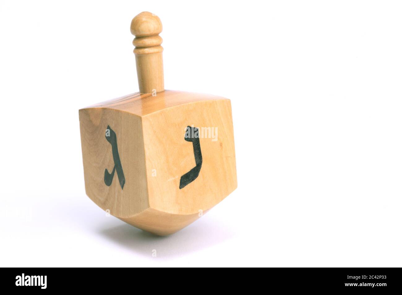 Wooden Dreidel, isolated over white background Stock Photo - Alamy