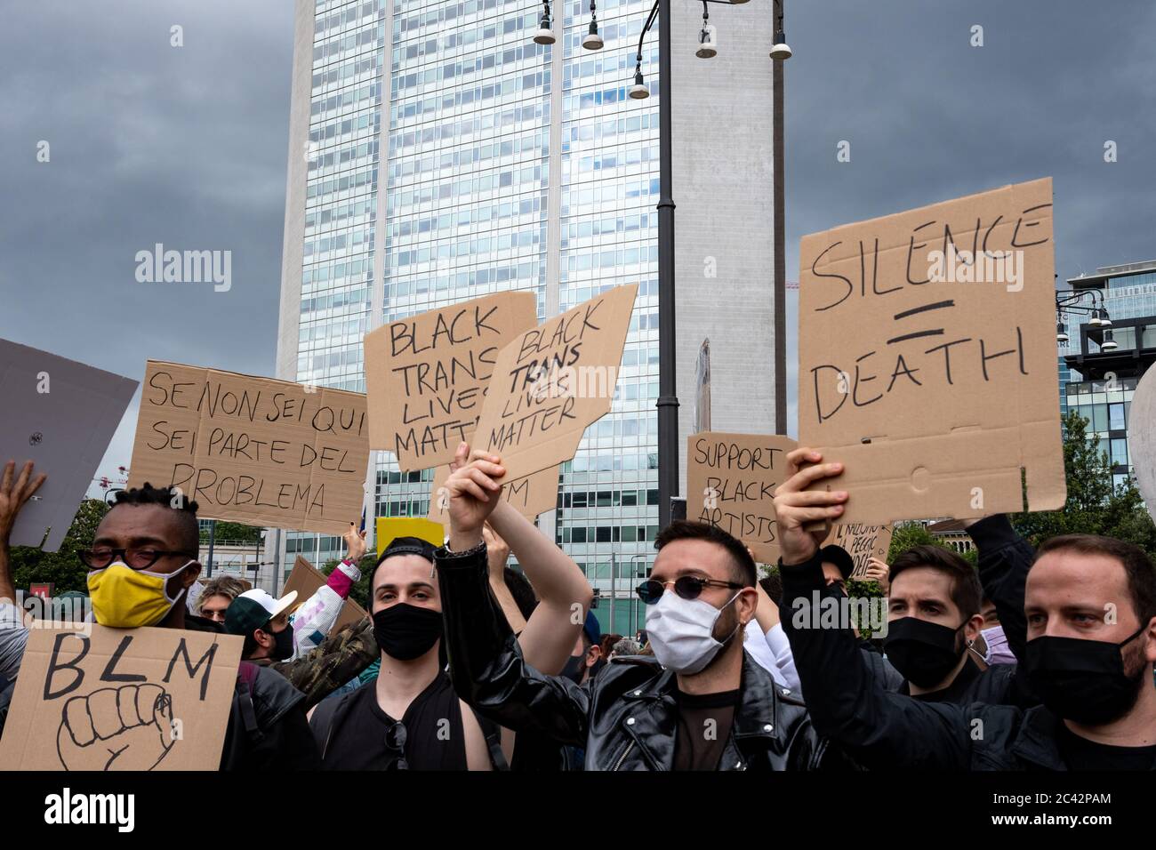 People holding boards about BLM, Queer and Trans black lives during the ...