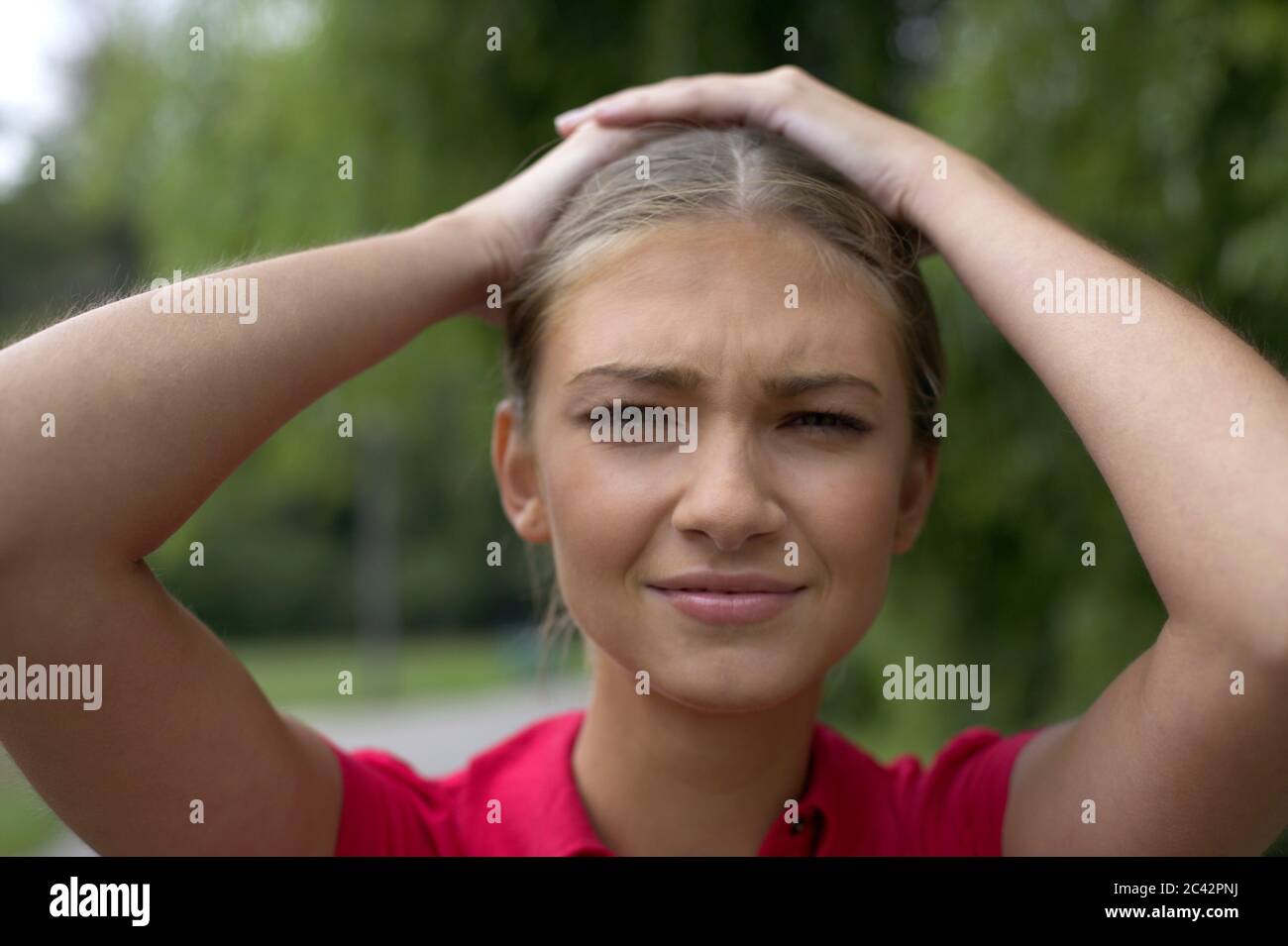 Young woman looks desperately at the camera Stock Photo - Alamy