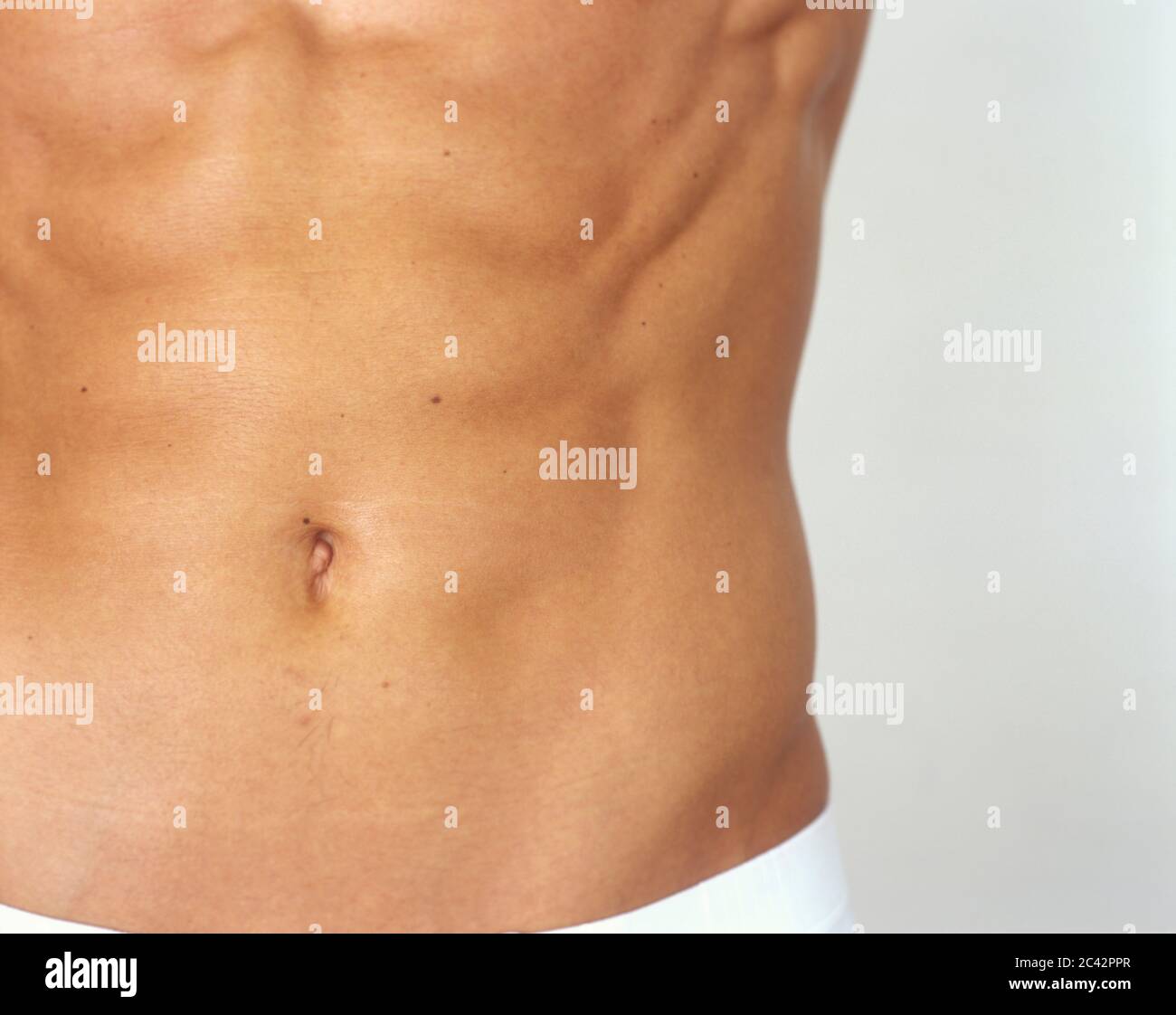 Muscular belly of a man - physicality Stock Photo - Alamy