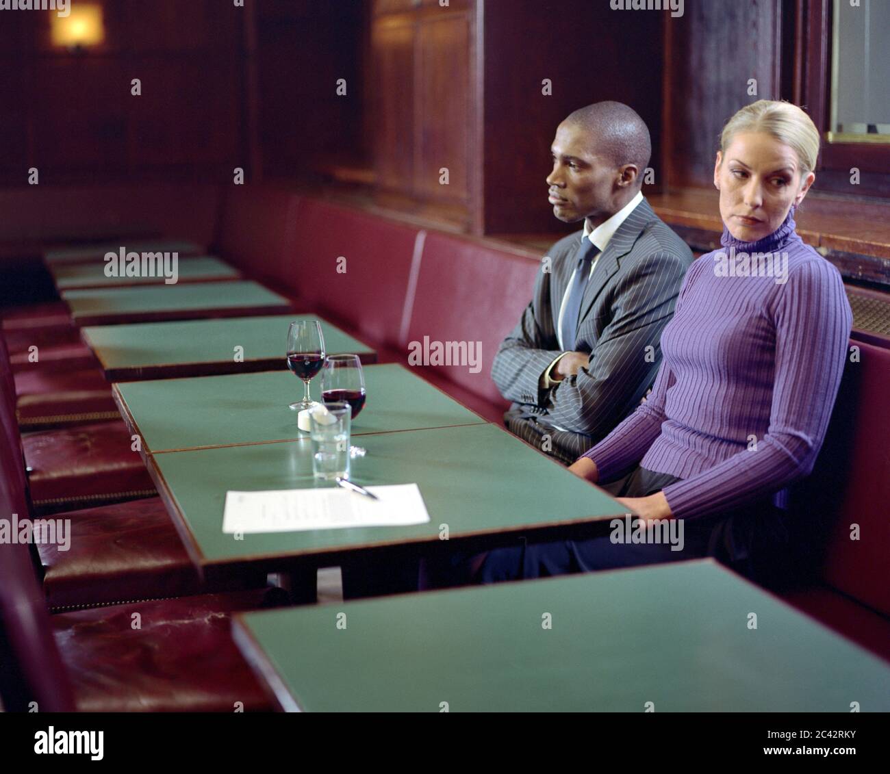 Couple at a table in an empty bar Stock Photo - Alamy