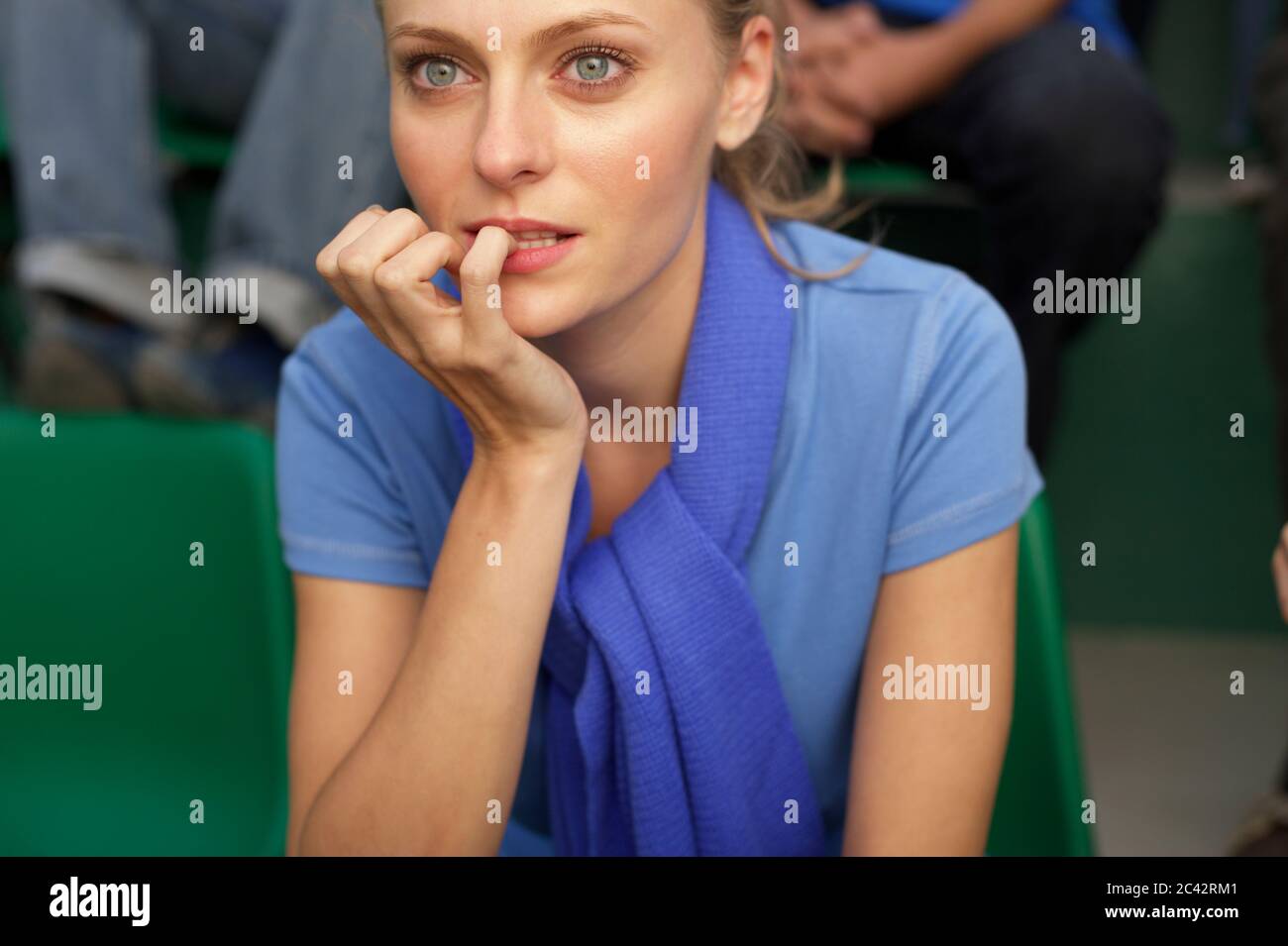 Young woman cheers in the stadium Stock Photo - Alamy