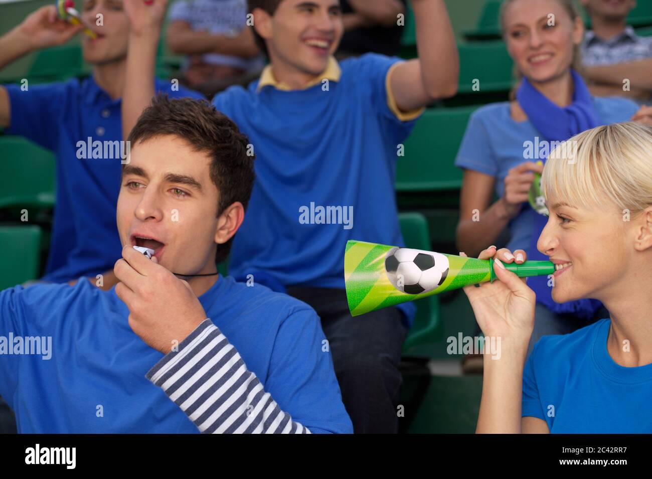 Fans cheer in the stadium Stock Photo - Alamy
