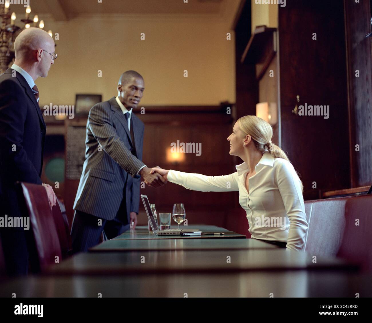 Business people in bar - business meeting Stock Photo - Alamy