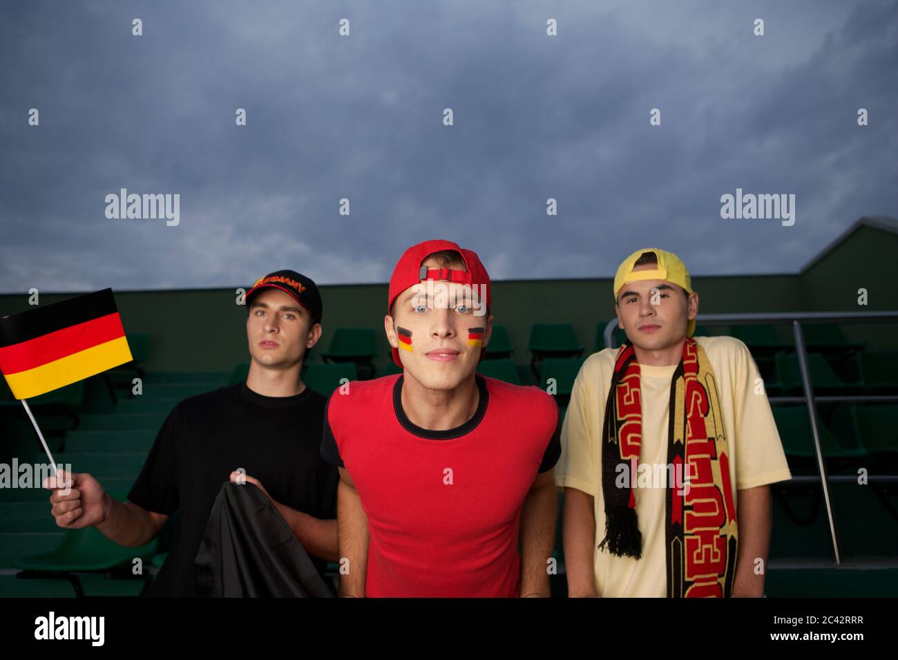 Three young German fans in the stadium Stock Photo - Alamy