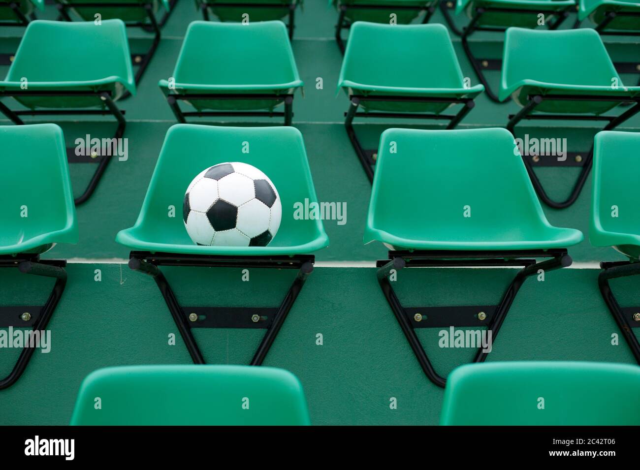Soccer ball on an empty seat - stadium Stock Photo - Alamy
