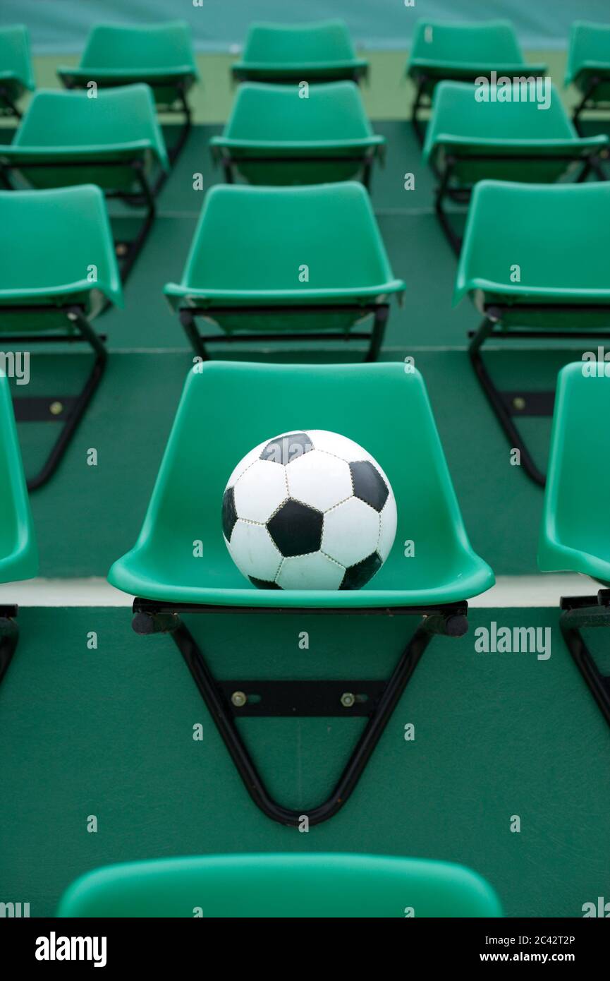 Soccer ball on an empty seat - stadium Stock Photo - Alamy