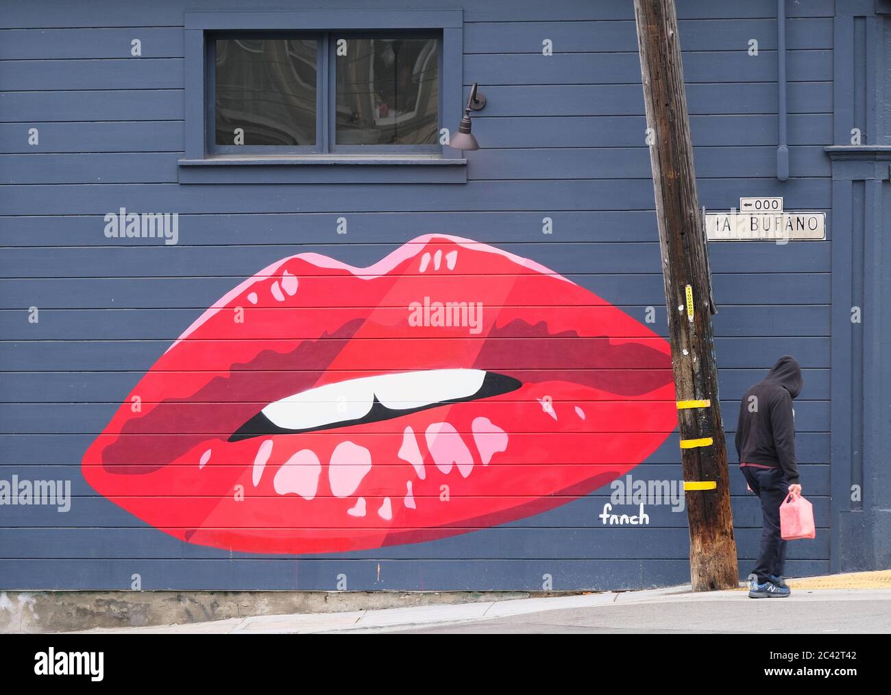 Man Walking Past Lips Stock Photo - Alamy