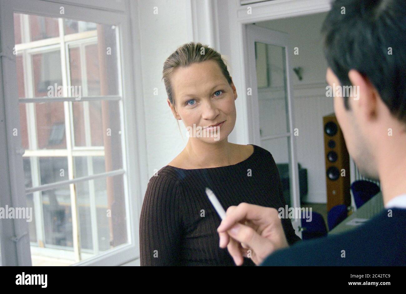 Smoking man talking woman hi-res stock photography and images - Alamy