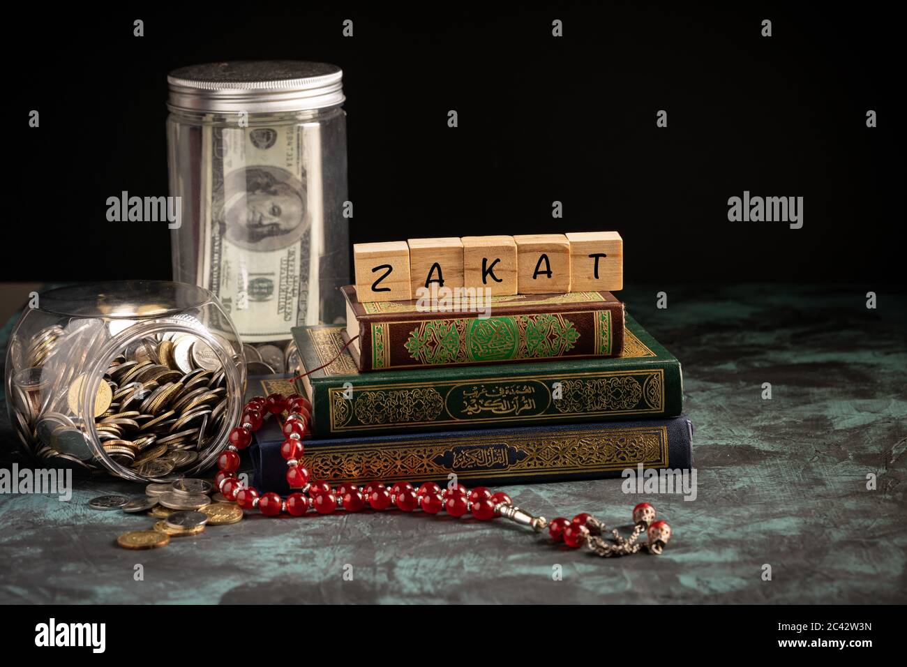 Zakat Islamic Concept. “ZAKAT” wordings wih coins in jar on wooden ...