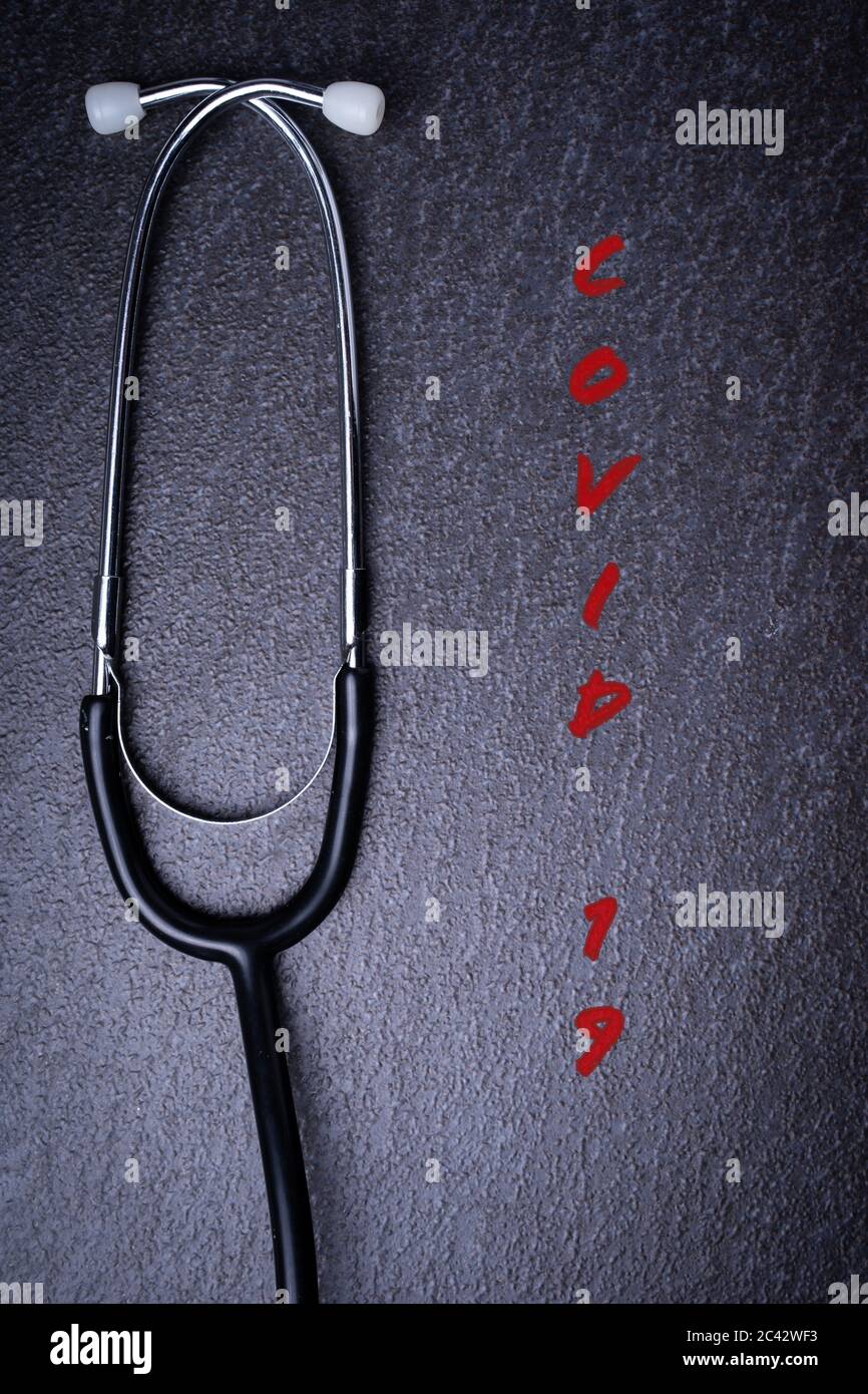 Black stethoscope on a dark surface with copy space for text Stock ...
