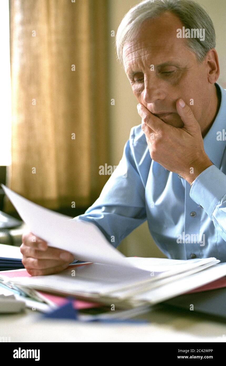 Man holds notice of termination in hands - letter - work Stock Photo ...