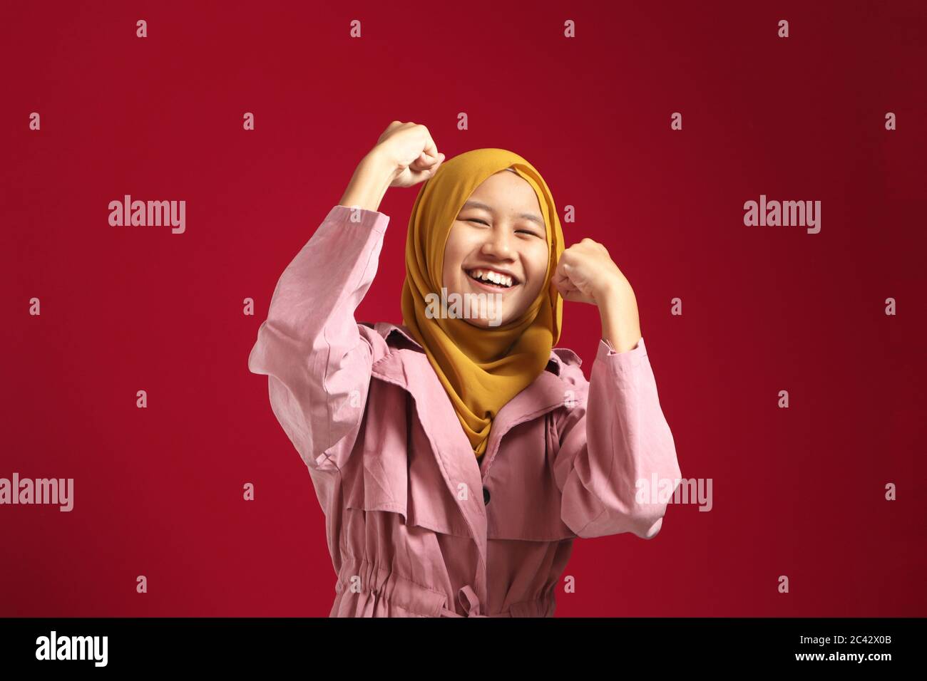 Portrait of happy success confident young teenage Asian muslim girl ...