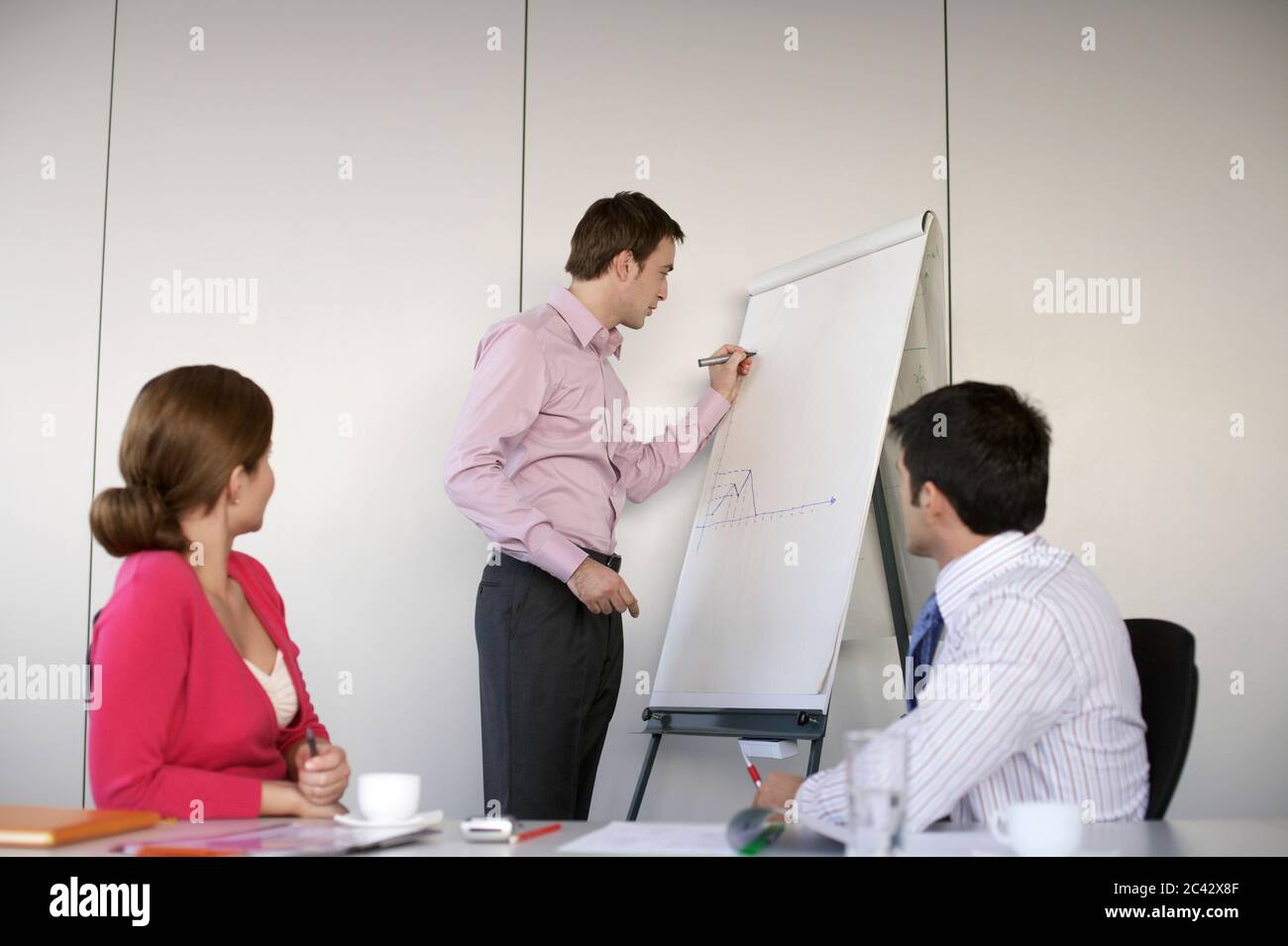 Three business people are talking - conference Stock Photo - Alamy