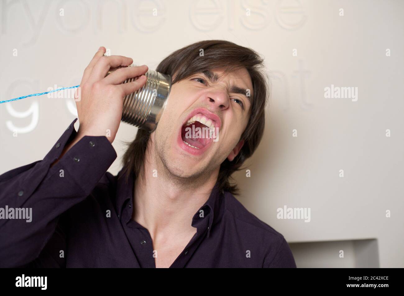 Screaming man holds hi-res stock photography and images - Alamy