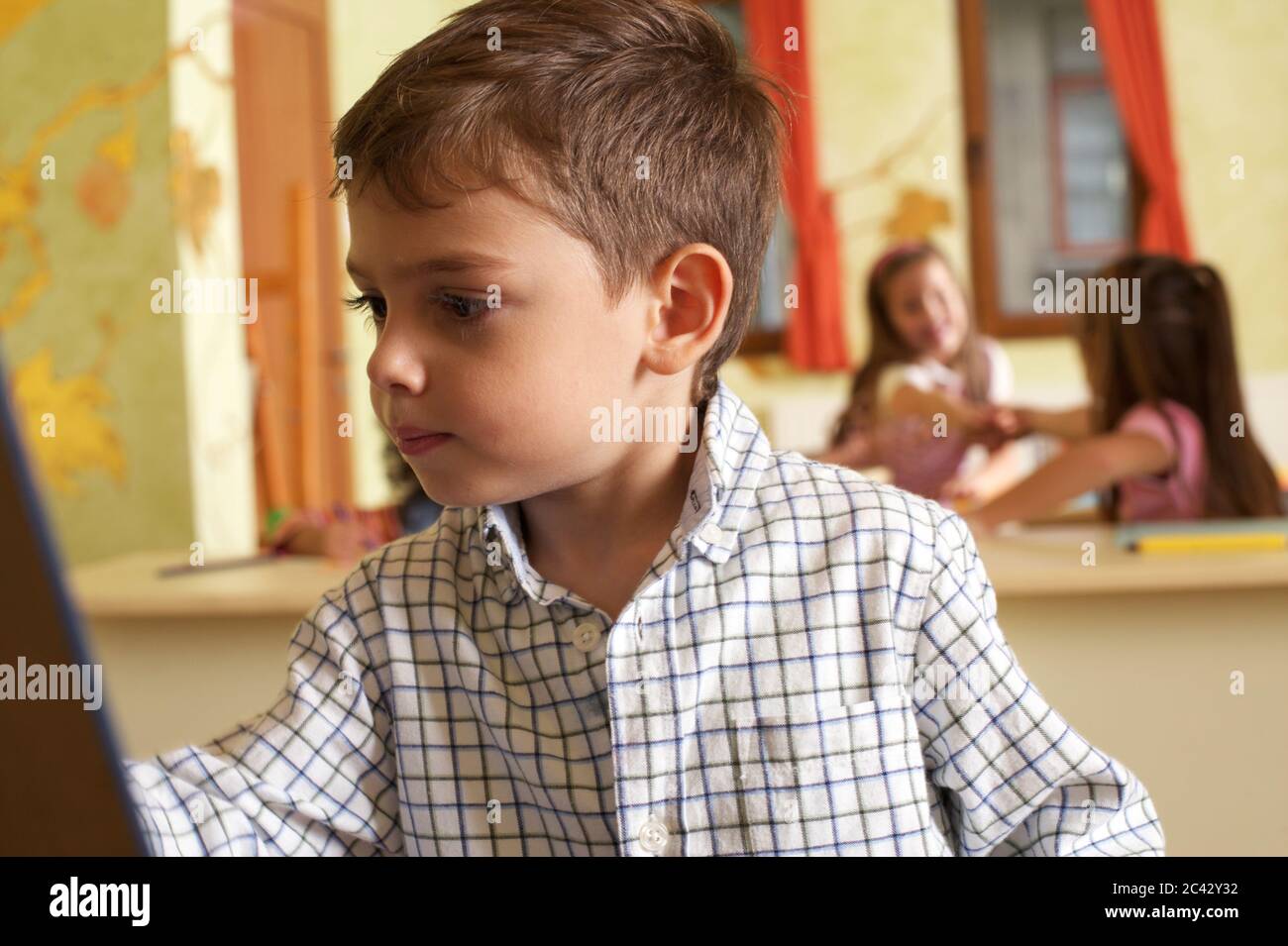Little boy in preschool - concentration, interest Stock Photo - Alamy