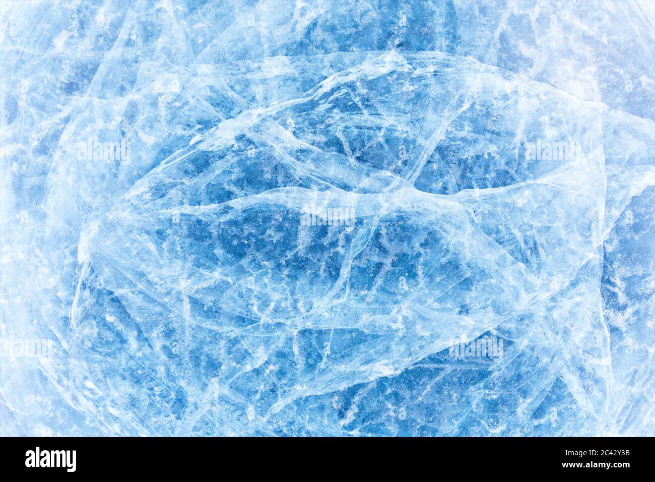 Surface of winter ice on Baikal lake in Siberia . Blue background of ...