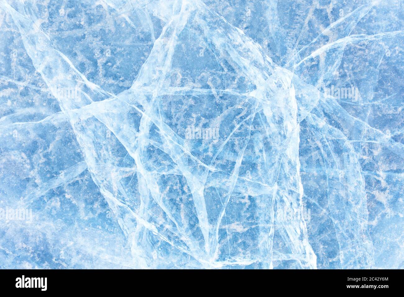 Surface of winter ice on Baikal lake in Siberia . Blue background of ...