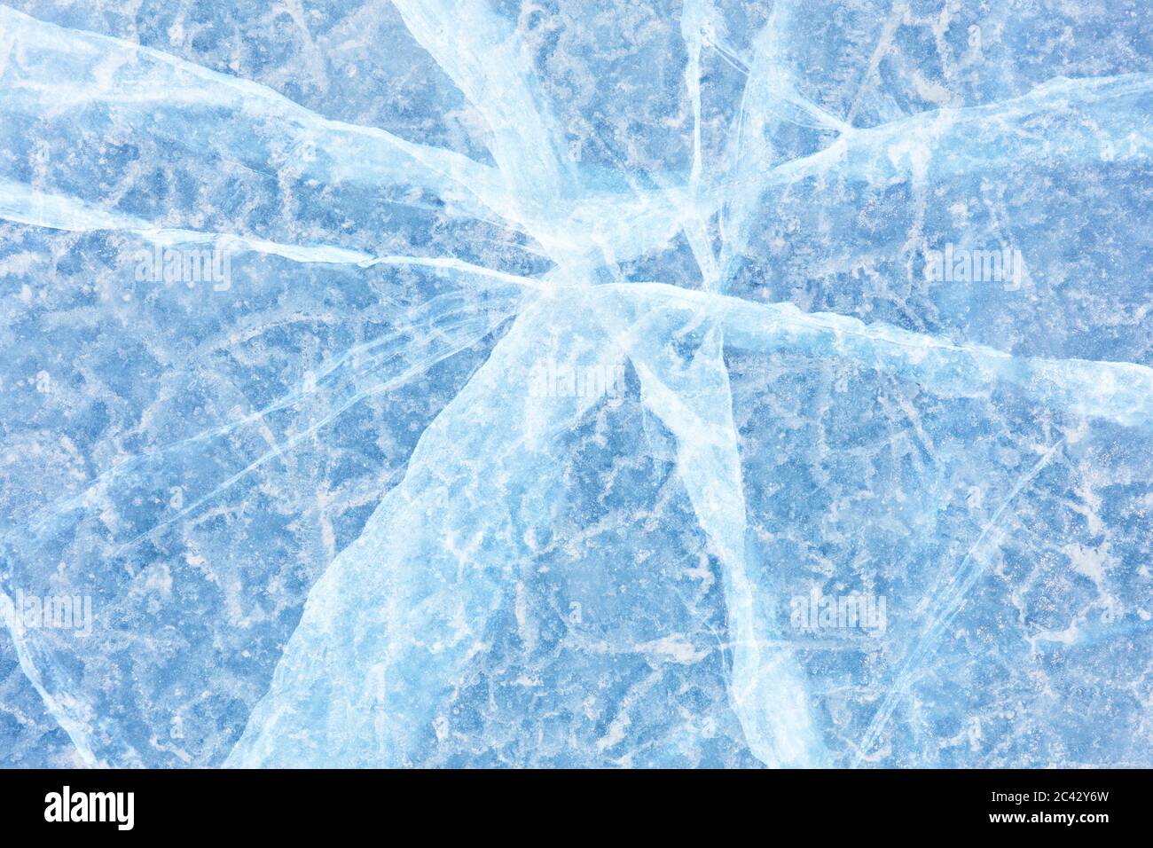 Surface of winter ice on Baikal lake in Siberia . Blue background of ...