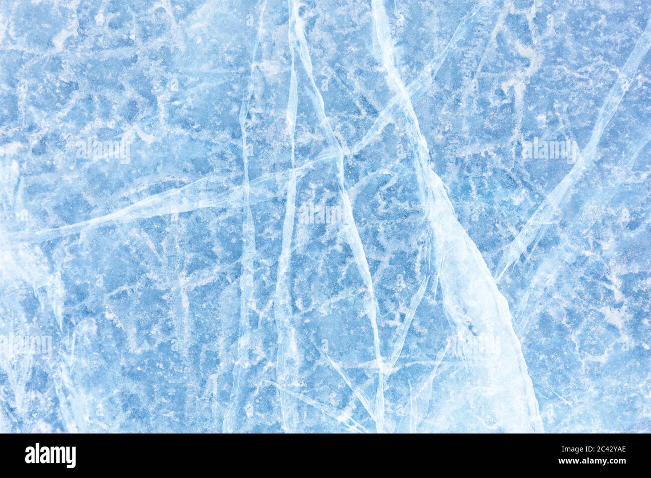 Surface of winter ice on Baikal lake in Siberia . Blue background of ...