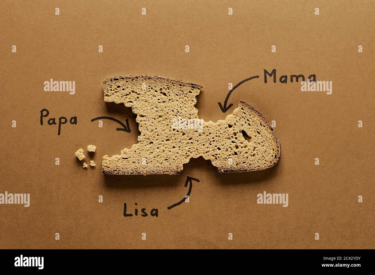 Bitten slice of bread Stock Photo - Alamy