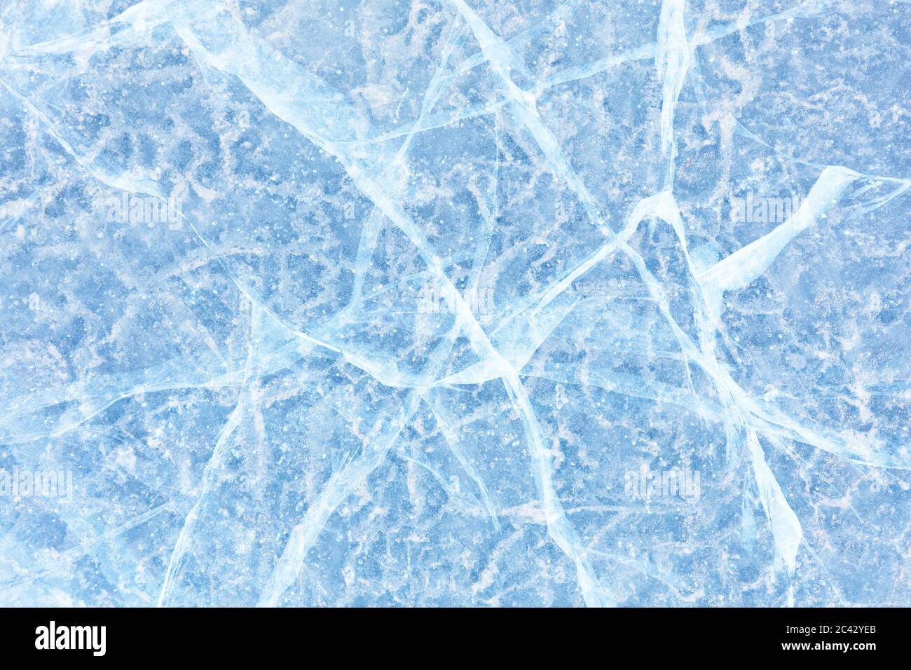 Surface of winter ice on Baikal lake in Siberia . Blue background of ...