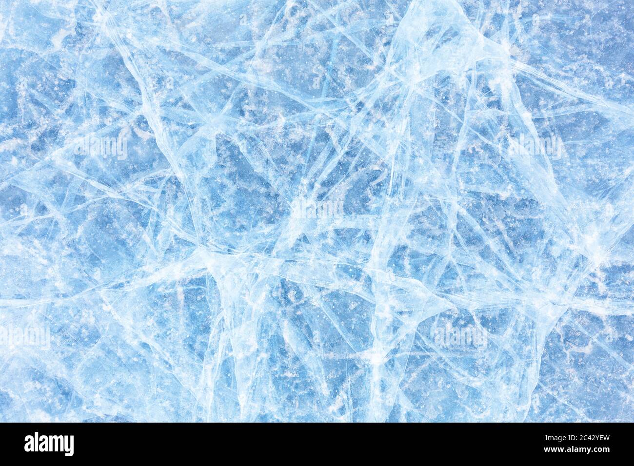 Surface of winter ice on Baikal lake in Siberia . Blue background of ...