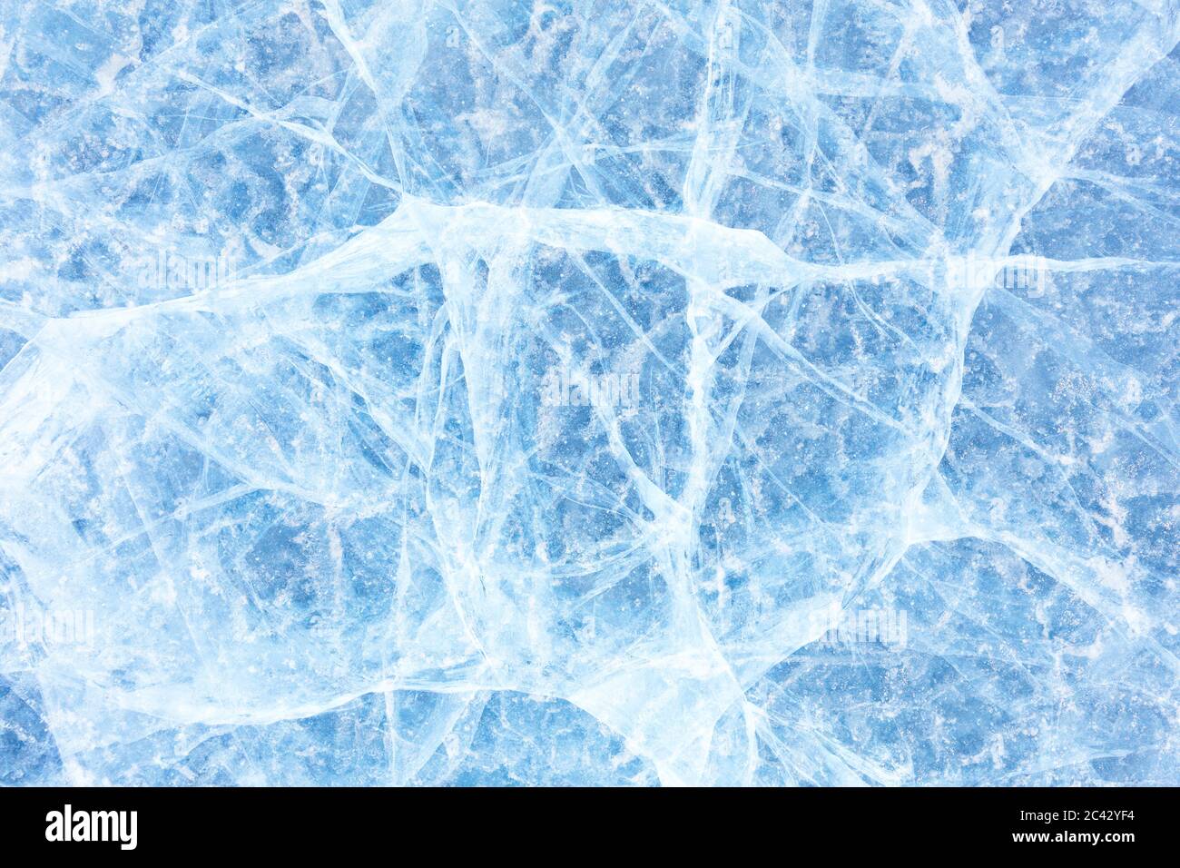 Surface of winter ice on Baikal lake in Siberia . Blue background of ...