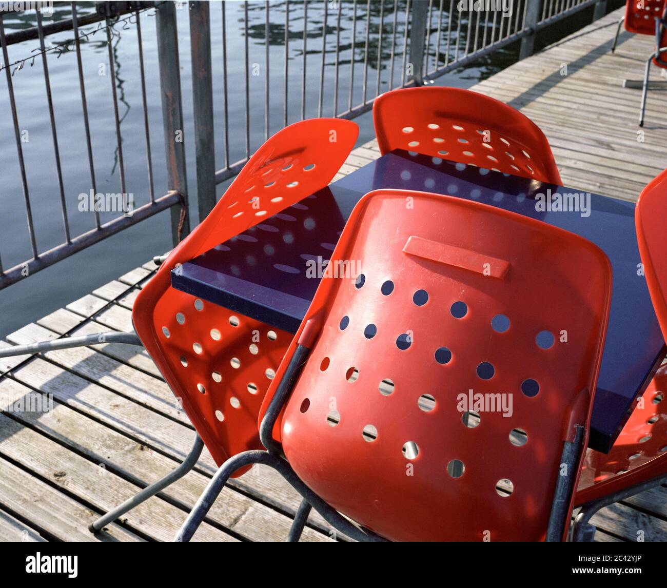 Chairs lean against table hi-res stock photography and images - Alamy