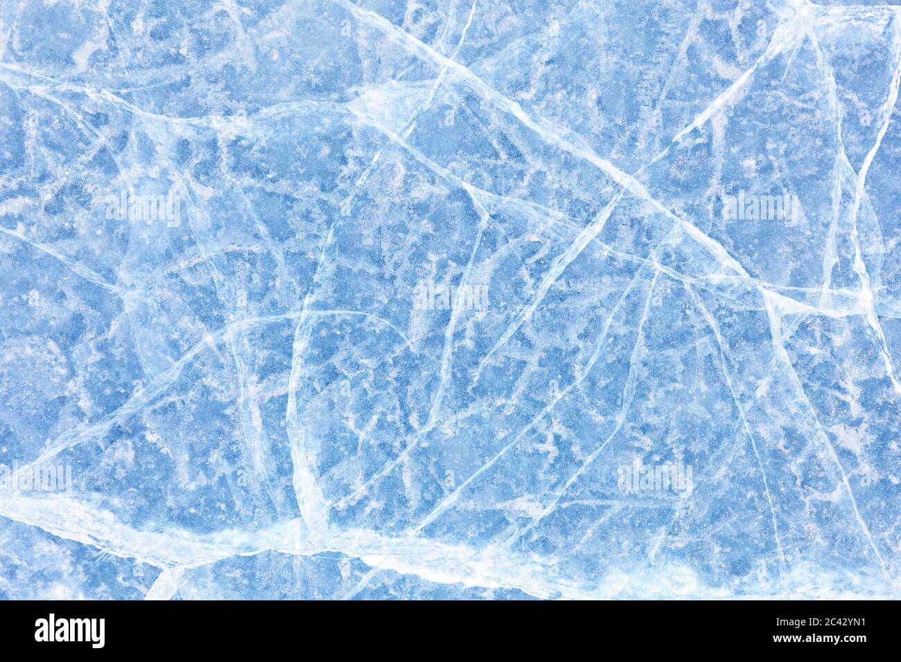 Surface of winter ice on Baikal lake in Siberia . Blue background of ...