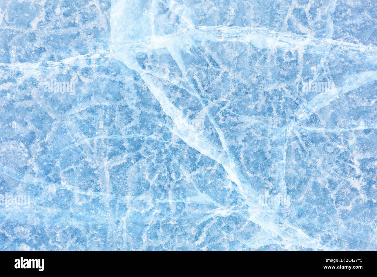 Surface of winter ice on Baikal lake in Siberia . Blue background of ...