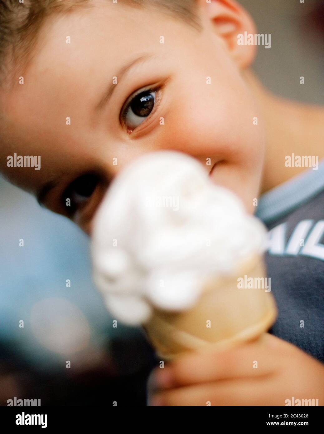 Boy with ice cream cone in hand - candy - childhood Stock Photo - Alamy