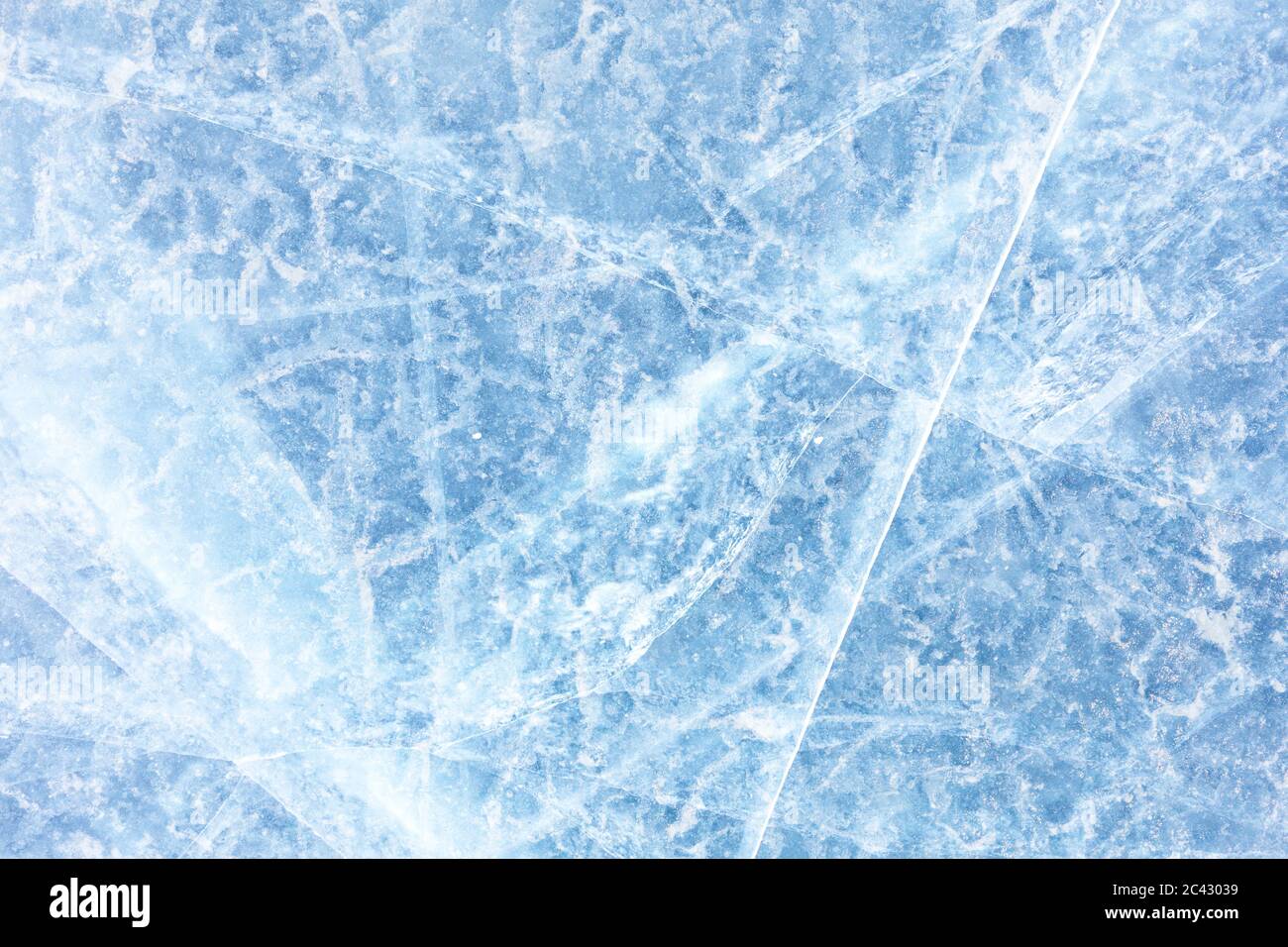 Surface of winter ice on Baikal lake in Siberia . Blue background of ...