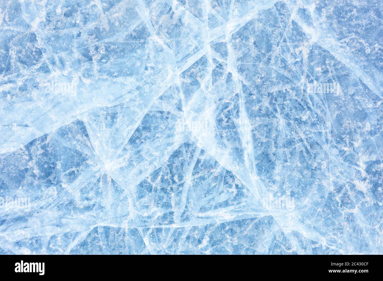 Surface of winter ice on Baikal lake in Siberia . Blue background of ...