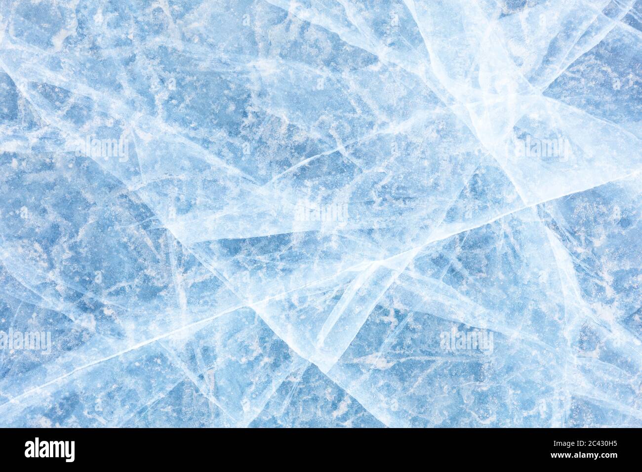 Surface of winter ice on Baikal lake in Siberia . Blue background of ...