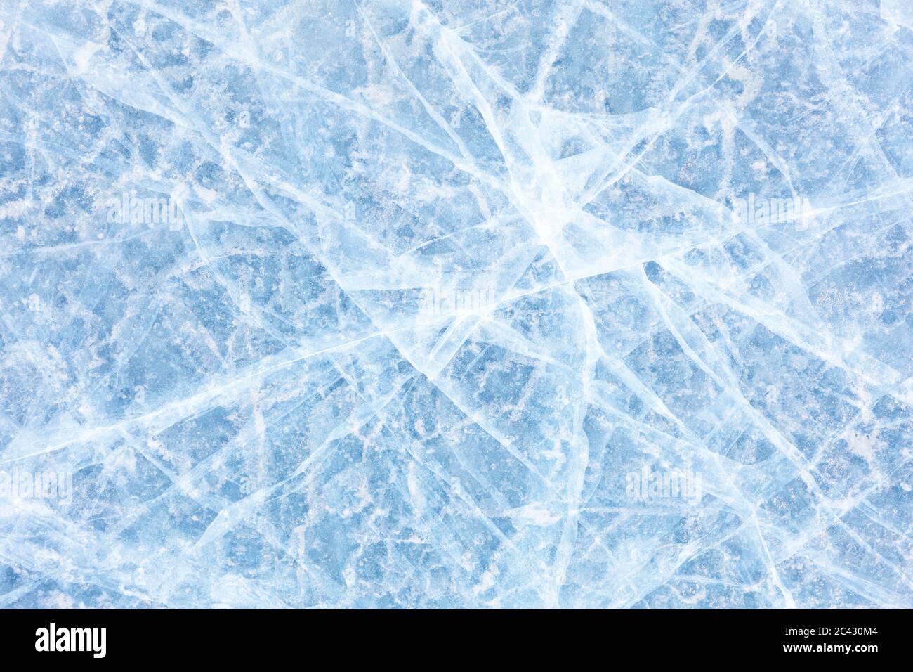 Surface of winter ice on Baikal lake in Siberia . Blue background of ...