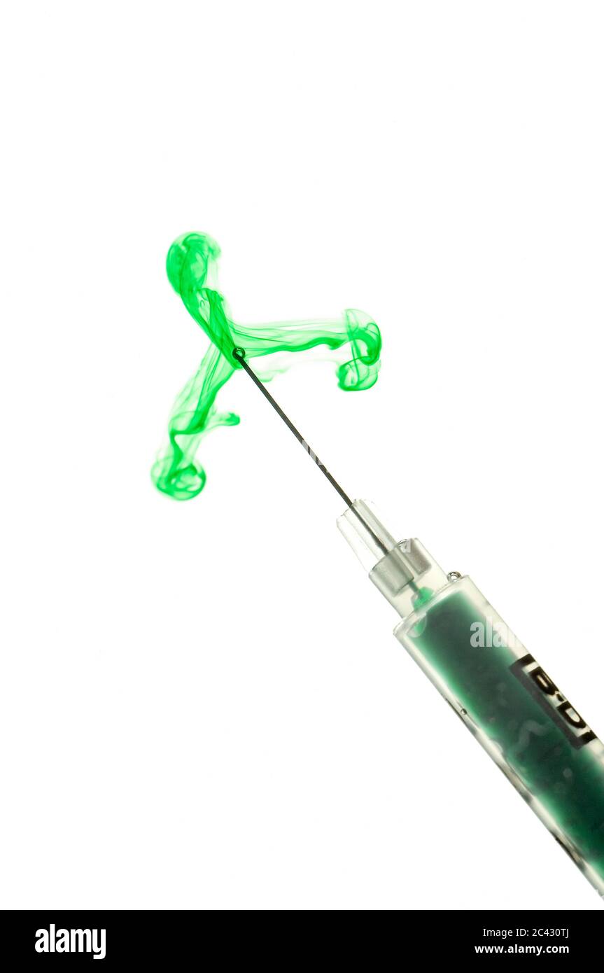 Green liquid inside and outside a syringe - injection - medicine Stock ...