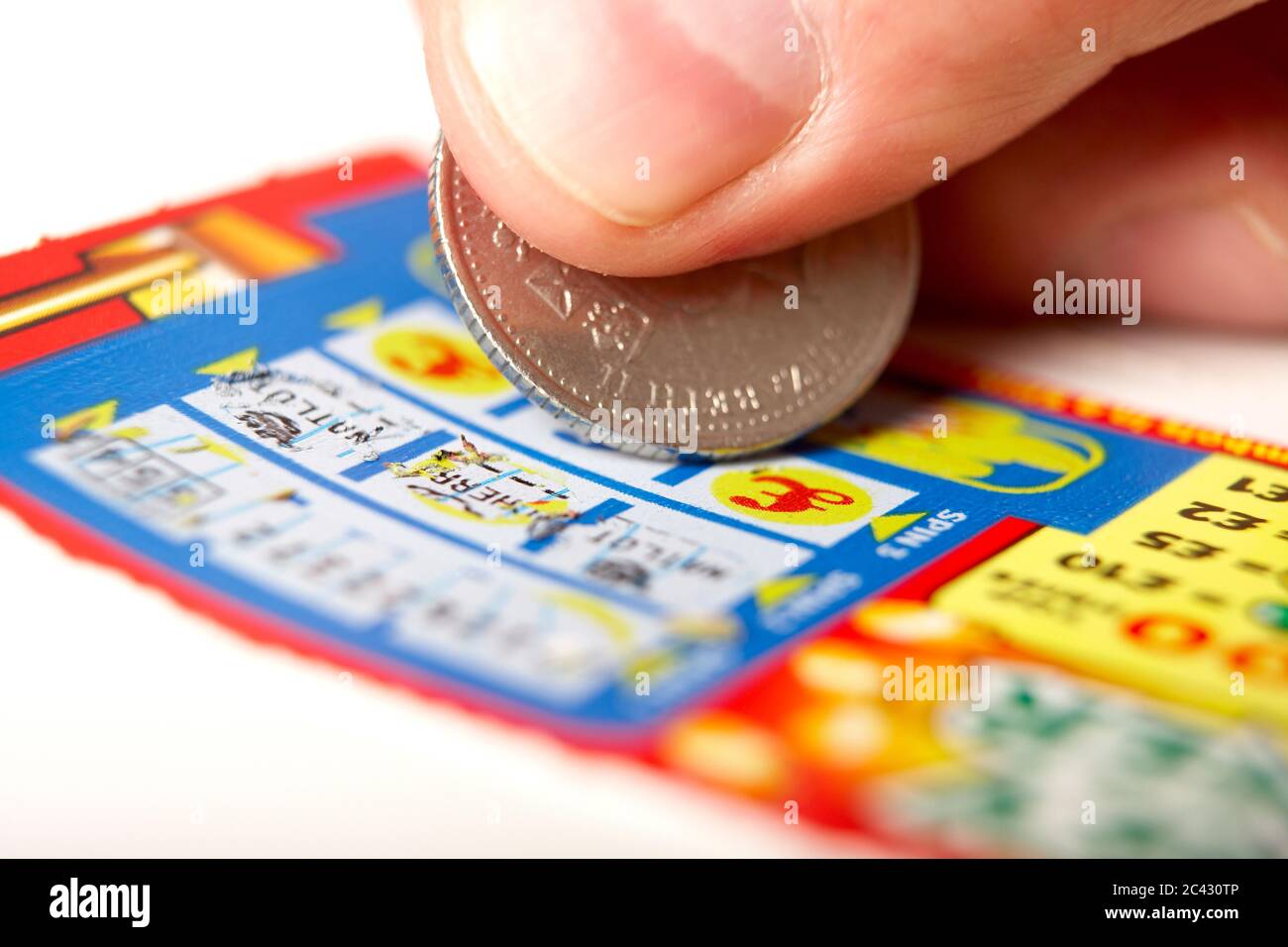 A hand scratches a lot with a coin Stock Photo - Alamy