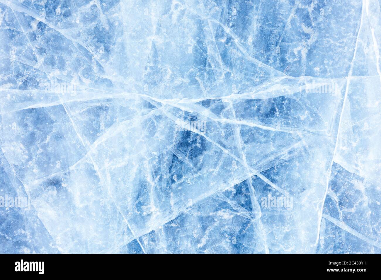 Surface of winter ice on Baikal lake in Siberia . Blue background of ...