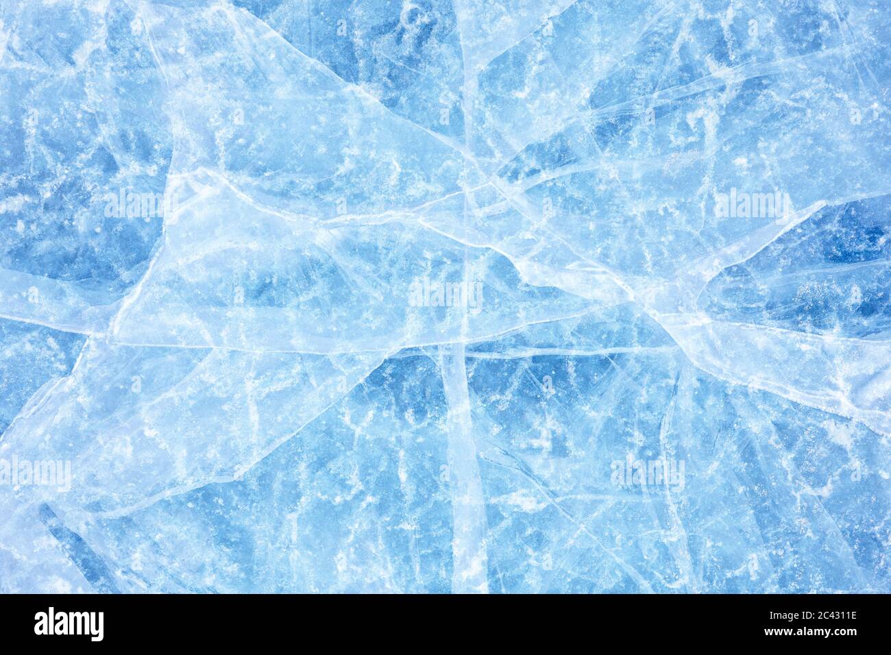 Surface of winter ice on Baikal lake in Siberia . Blue background of ...
