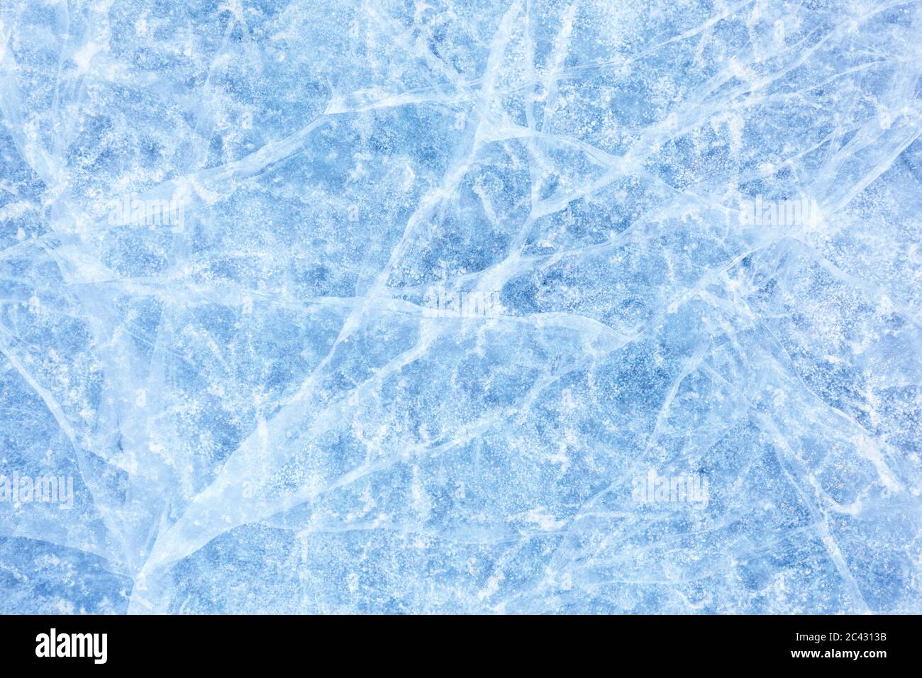 Surface of winter ice on Baikal lake in Siberia . Blue background of ...