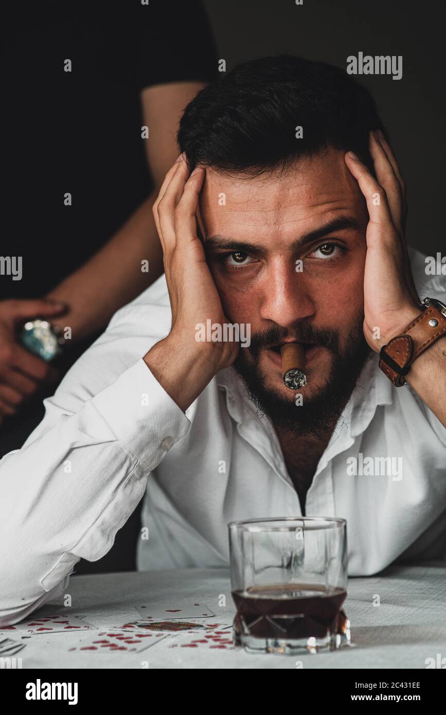 Portrait of gambler man who lost in gambling Stock Photo - Alamy